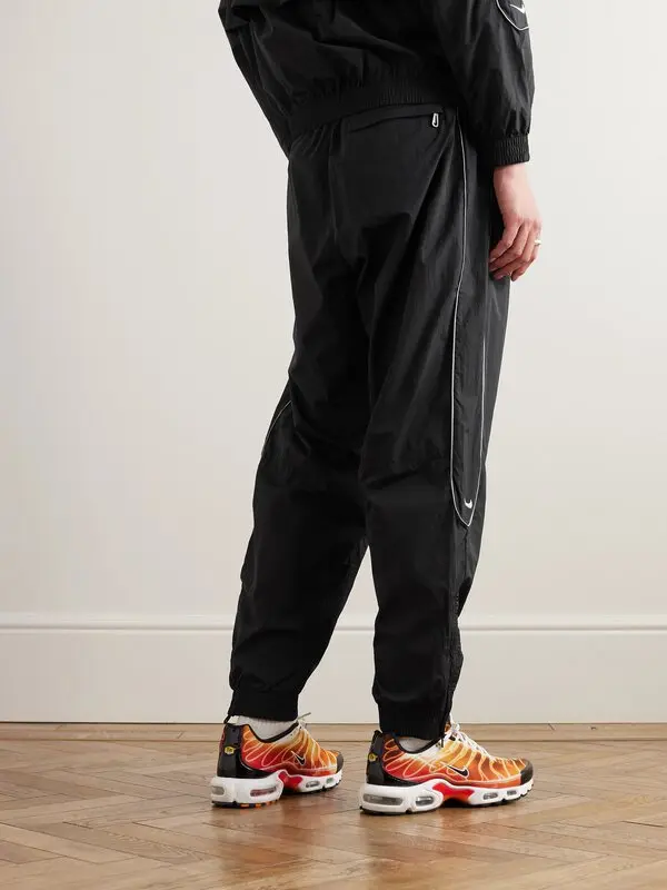 Nike Solo Swoosh Tapered Logo-Embroidered Taffeta Track Pants In