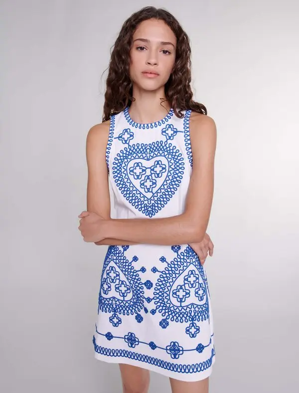 sachin and babi light blue dress Embroidered Long Shirt Black organic cotton poplin longline shirt with  placed gara stitch inspired embroidery on the front placket and sleeve cuff.  Embroidered piping border detail frames the concealed placket and edges