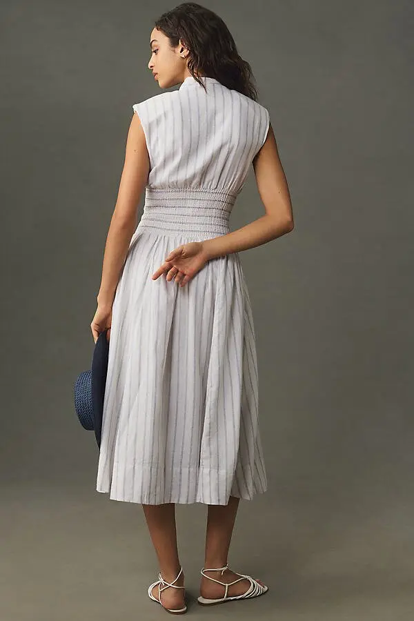 the tommie cap-sleeve smocked front-zip shirt dress: mini denim edition By Anthropologie Tommie Cap-Sleeve Denim Smocked Front-Zip Mini Shirtdress  at MarketFair Shoppes in Princeton, NJ