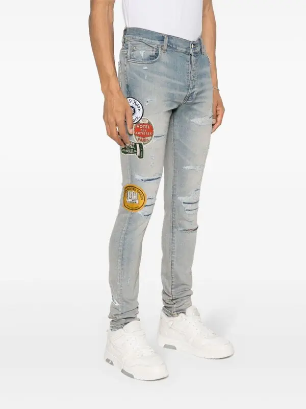 Amiri Travel Patch Repair Skinny Jeans