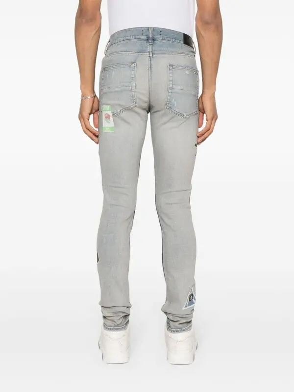 Amiri Travel Patch Repair Skinny Jeans