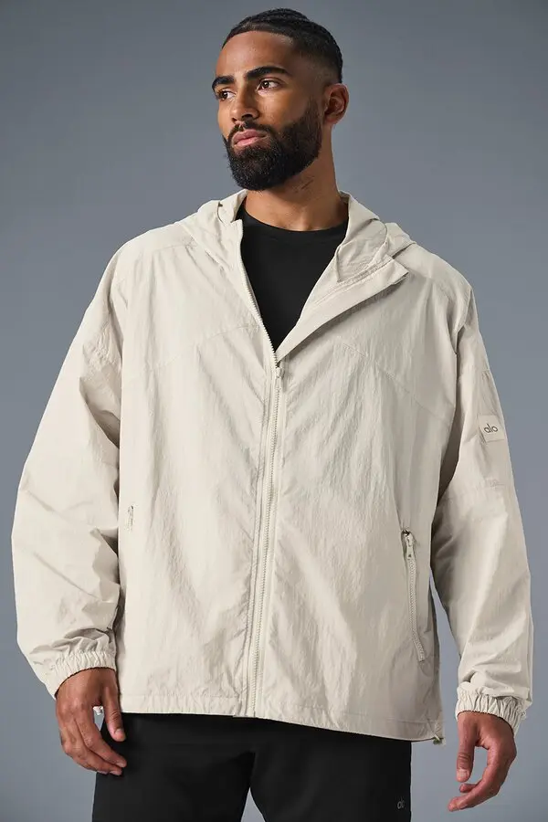 Alo Yoga Vantage Nylon Ripstop Track Jacket In Beige - Bone