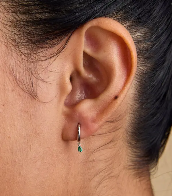 ASTRID & MIYU White Gold And Emerald Pear Huggie Hoop Earrings - Silver