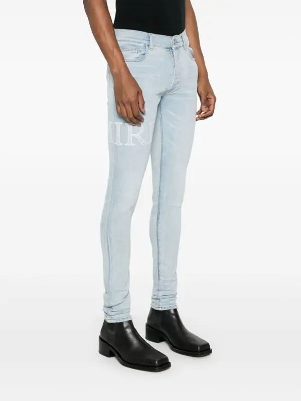 Amiri Bandana-jacquard Logo Appliqué Jeans
