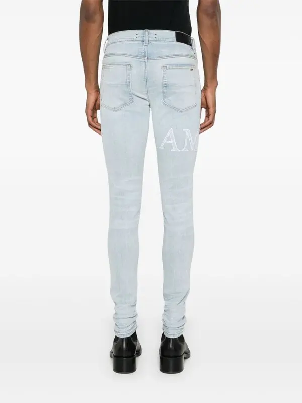 Amiri Bandana-jacquard Logo Appliqué Jeans