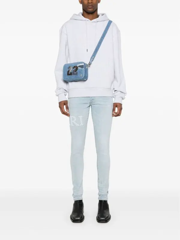 Amiri Logo Embroidered Skinny Jeans In Blue - 25% Off | Editorialist