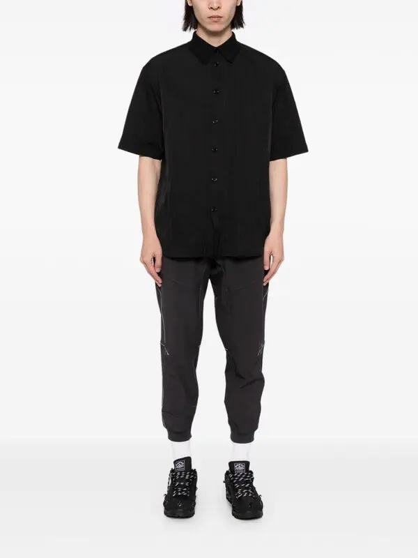 AND WANDER Water-repellent Tapered Trousers