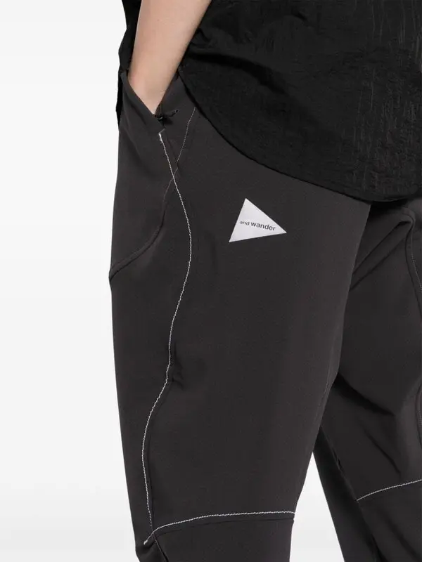 AND WANDER Water-repellent Tapered Trousers