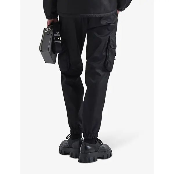 Prada Re-nylon Buckle-embellished Tapered Slim-fit Trousers