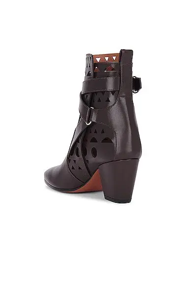 Alaïa Perforated Ankle Boots With Buckle Detail