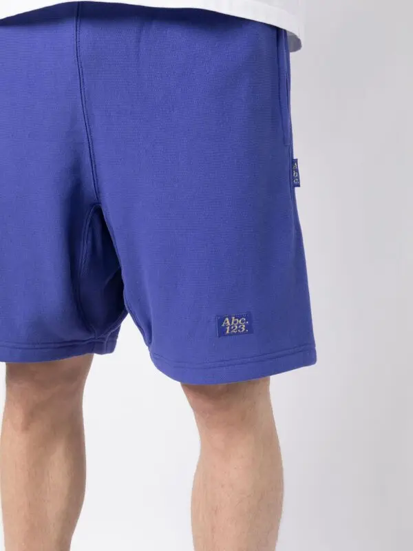 ADVISORY BOARD CRYSTALS Logo-embroidered Cotton Track Shorts - Blue