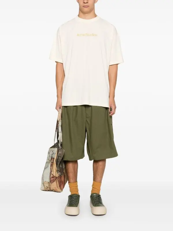 Acne Studios Blurred Logo T-Shirt In Yellow - 40% Off | Editorialist