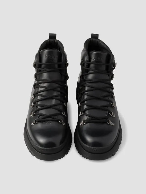 Prada Brixxen Leather Booties - Black