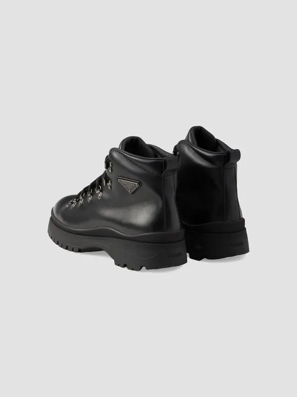 Prada Brixxen Leather Booties - Black