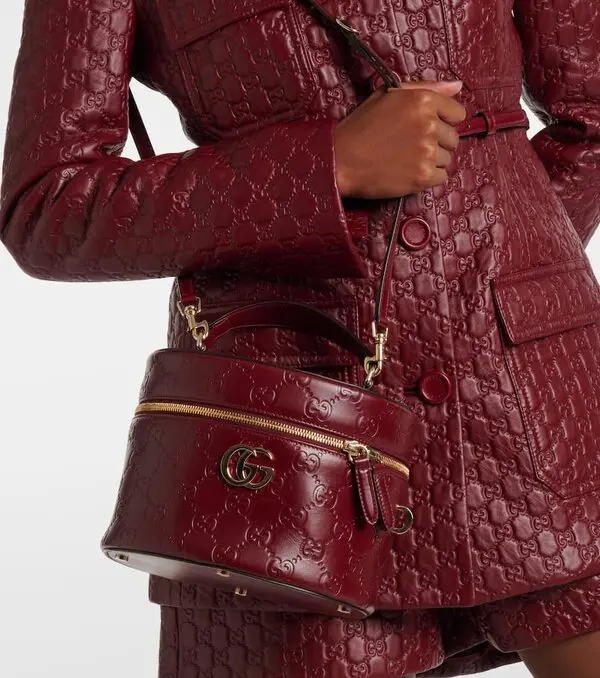 Gucci Gg Embossed Leather Vanity Bag - Burgundy | Editorialist