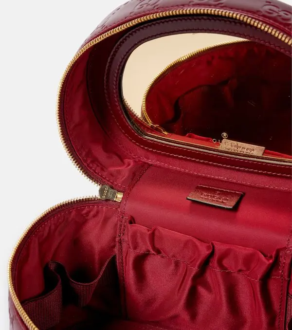 Gucci Gg Embossed Leather Vanity Bag - Burgundy | Editorialist