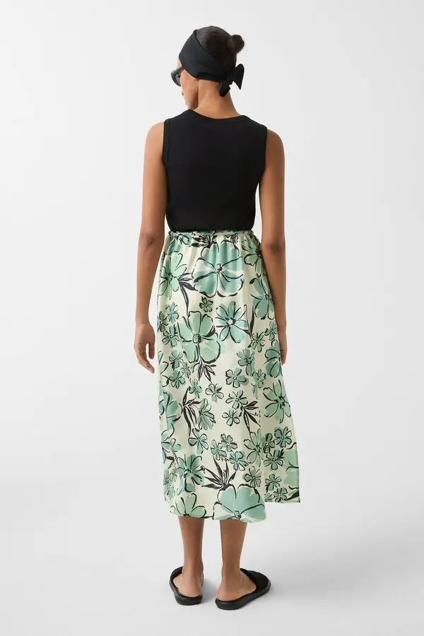 green and black jersey dress Diane von Furstenberg 1975-76 F/W Tulip Print Black Jersey Tunic Dress –  Featherstone Vintage main image 1