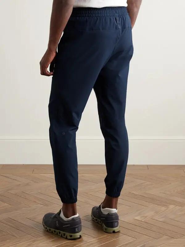 Lululemon License To Train Slim-fit Tapered Stretch Recycled-shell Track Pants - Blue