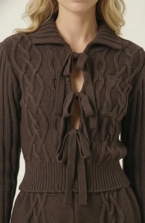 MODENAIRE Ribbed Knit Romper With Bow Tie Front And Long Sleeves