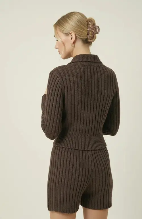MODENAIRE Ribbed Knit Romper With Bow Tie Front And Long Sleeves