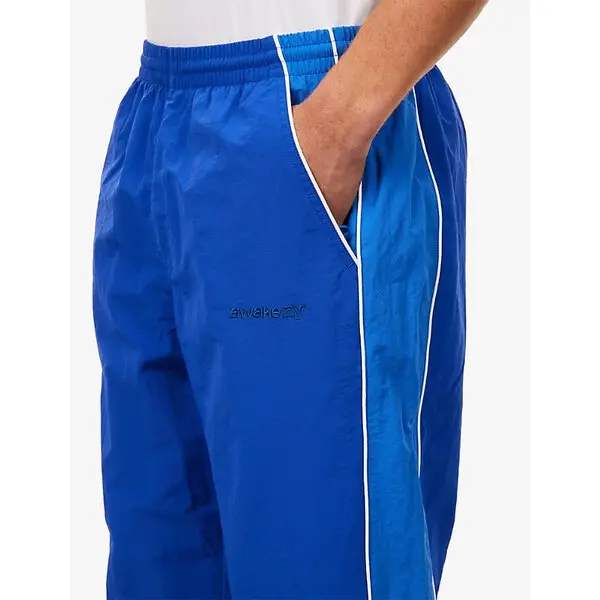 AWAKE NY Logo-embroidered Relaxed-fit Shell Track Bottoms