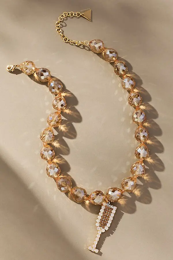 Anthropologie Festive Beaded Drink Charm Necklace - Champagne