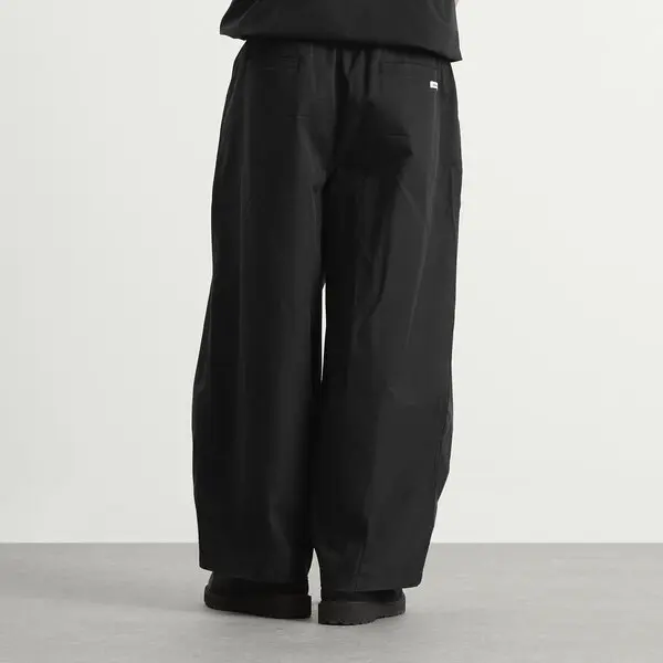 ANGLAN Unbalance Long Tuck Balloon Trousers