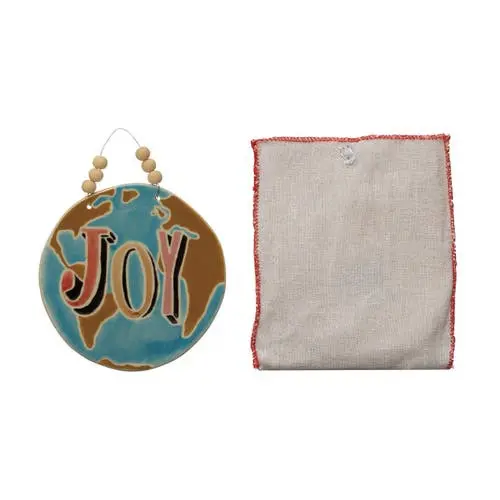 STORIED HOME Round Handmade Stoneware Ornament With Wax Relief "joy" In Linen Bag - Blue