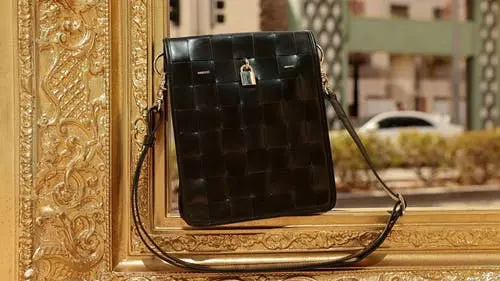 MADISON MAISON Woven Leather Crossbody Bag With Lock - Black