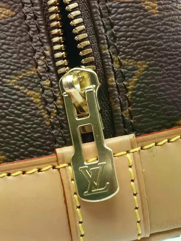LOUIS VUITTON Alma Pm Monogram Handbag - Brown