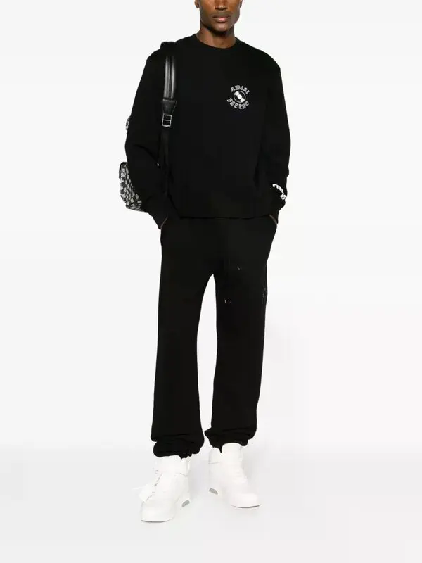 Amiri Staggered Logo-embroidered Track Pants - Black