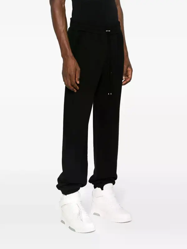Amiri Staggered Logo-embroidered Track Pants - Black