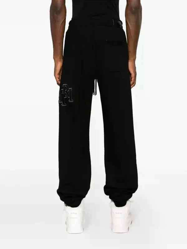 Amiri Staggered Logo-embroidered Track Pants - Black