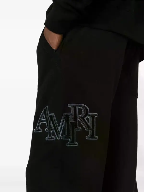 Amiri Staggered Logo-embroidered Track Pants - Black