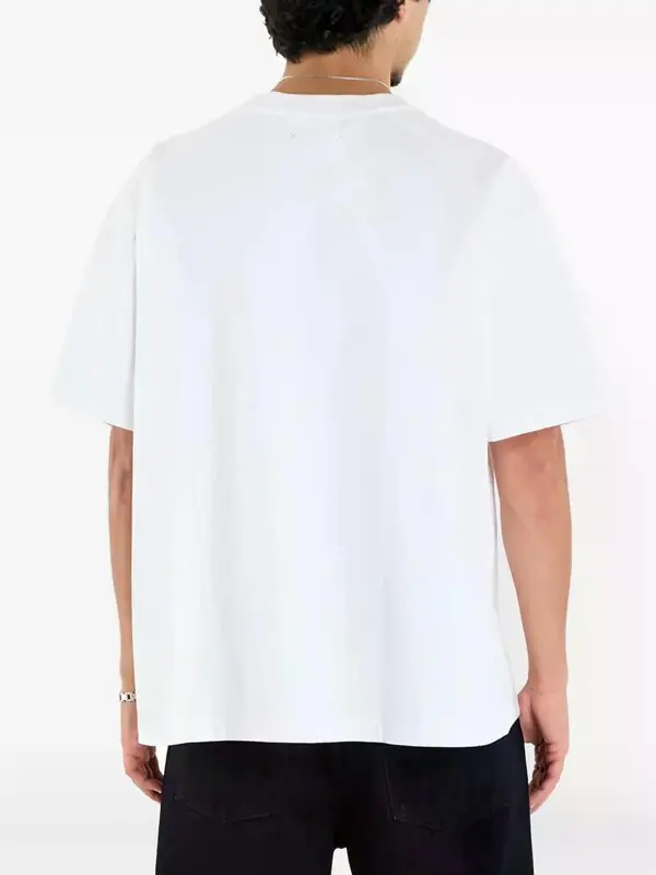 PLEASURES Relief Text-print T-shirt