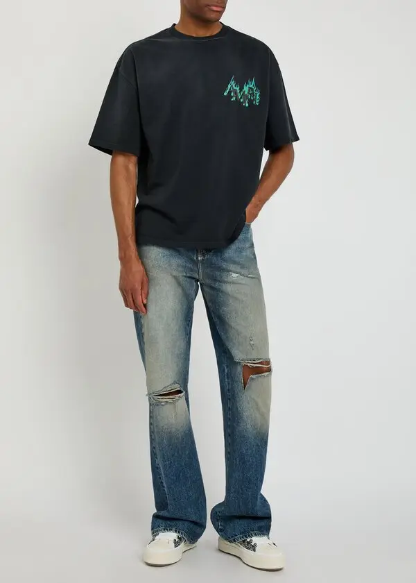 Amiri Slashed Distressed Bootcut Jeans