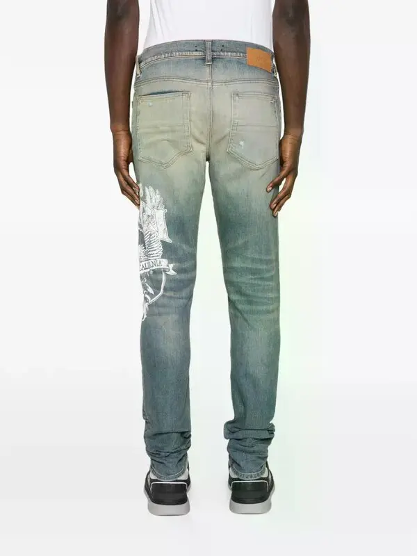 Amiri Graphic Print Ripped Jeans - Blue