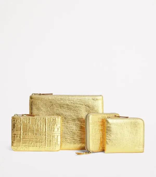 Comme Des Garçons Leather Embossed Logo Zipped Wallet