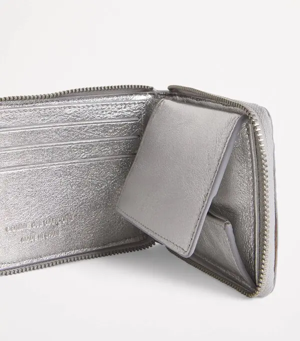 Comme Des Garçons Leather Embossed Logo Zipped Wallet