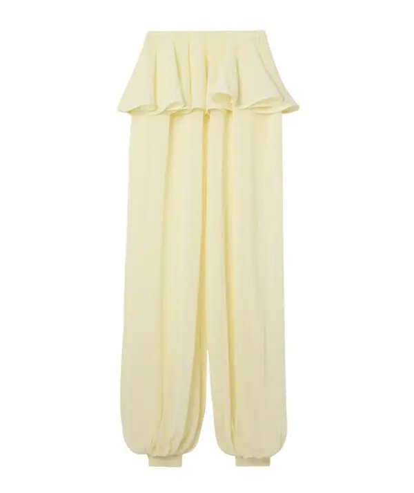 Alaïa Pleated Georgette Peplum Tapered Pants - Yellow