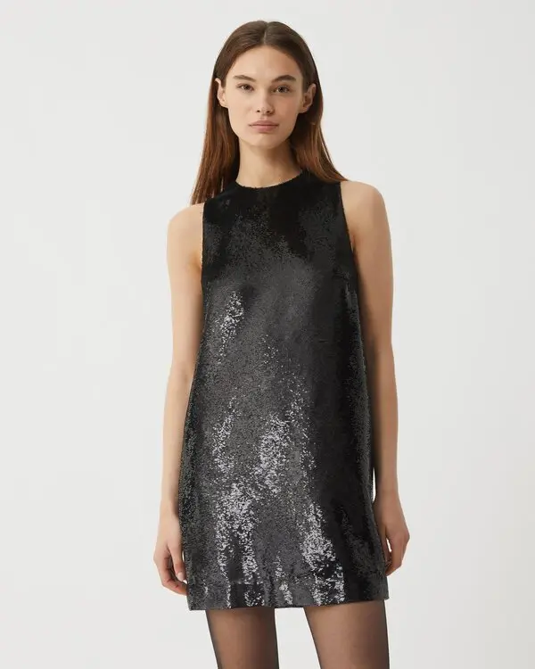 flat sequin dress A short handmade sequin dress, in 10mm flat iridescent dark sequins with a  black ruffled organza skirt