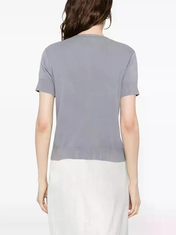 AGNES B. Short-sleeved Snap Top