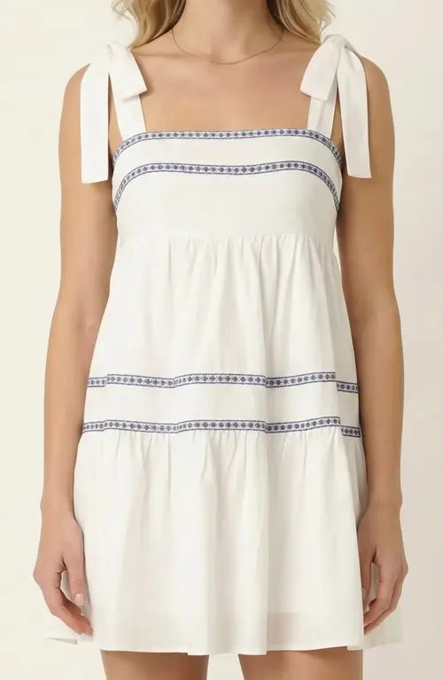 MODENAIRE Sleeveless Tiered Mini Dress With Bow Tie Shoulder Straps And Smocked Empire Waist - Ivory