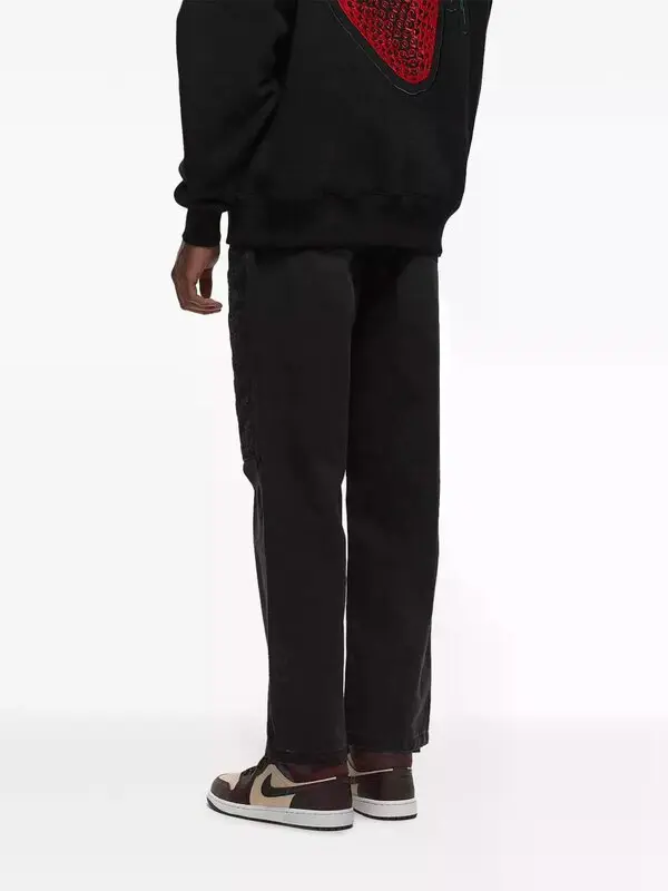 PLEASURES Logo-embroidered Jeans