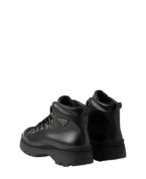Prada Brixxen Leather Booties - Black