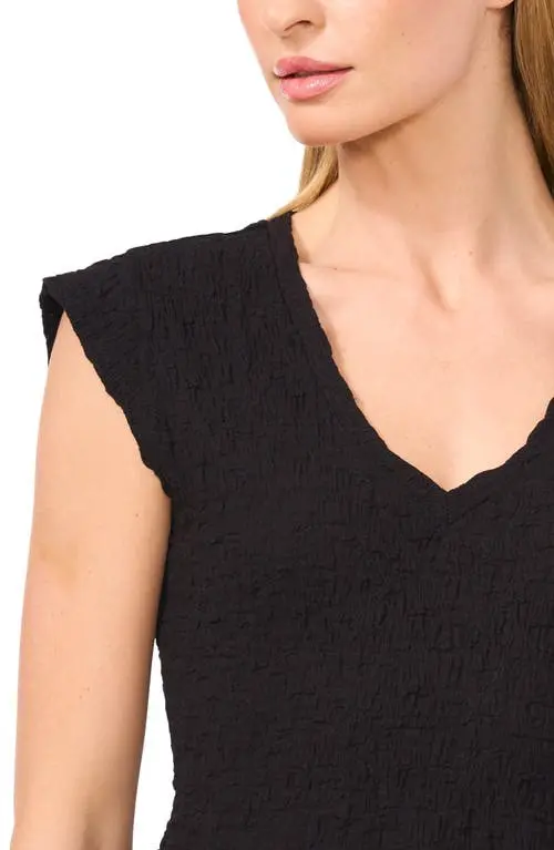 CECE DUPRAZ Puckered Knit Peplum Top
