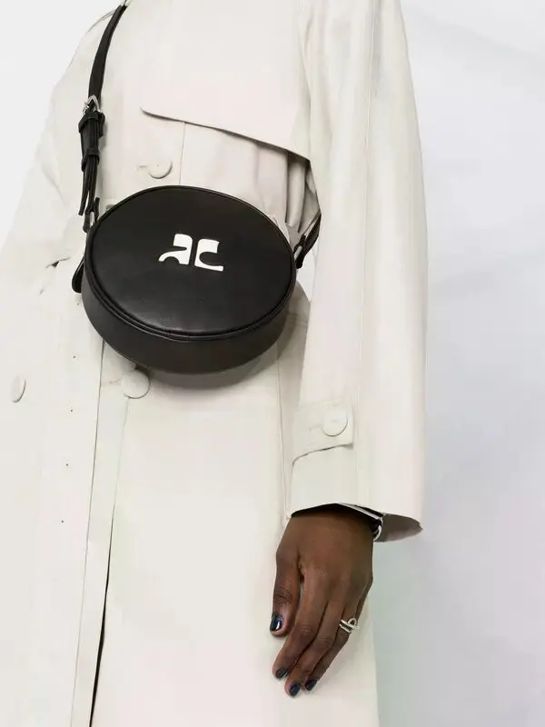 COURREGES Logo-embossed Rounded Crossbody Bag - Black