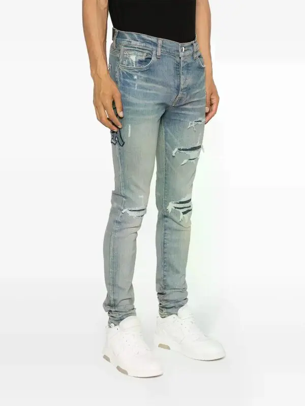 Amiri Distressed Skinny Jeans In Light