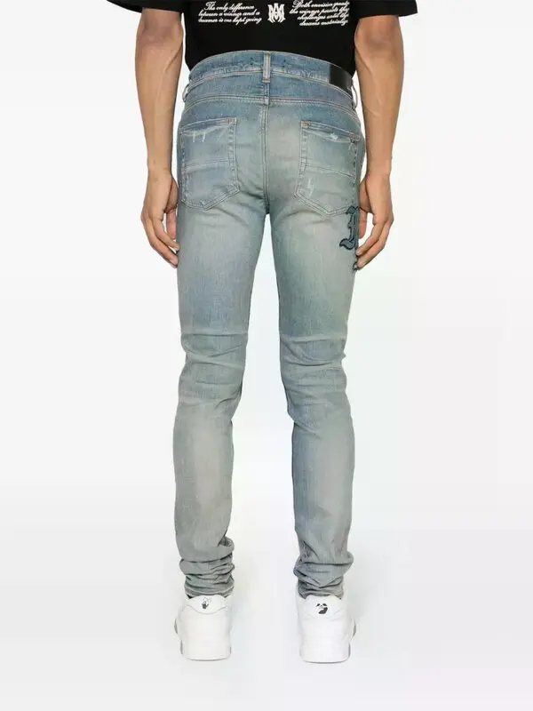 Amiri Distressed Skinny Jeans In Light