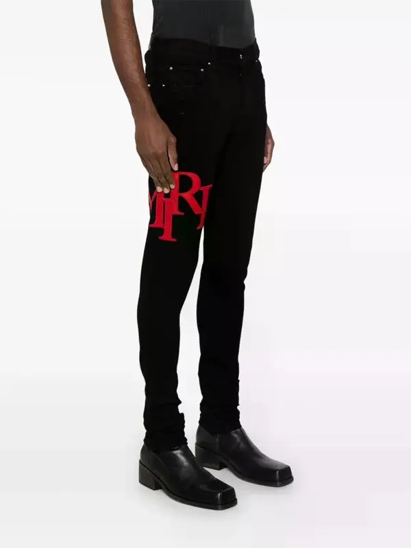 Amiri Staggered Logo Skinny Jeans